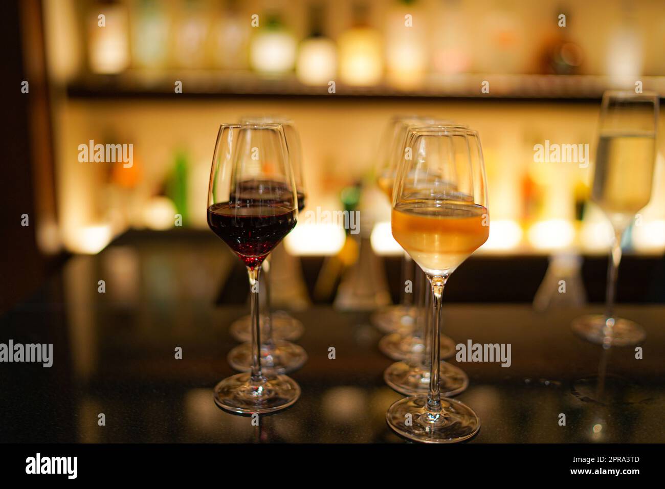 Wine placed on a bar counter Stock Photo - Alamy