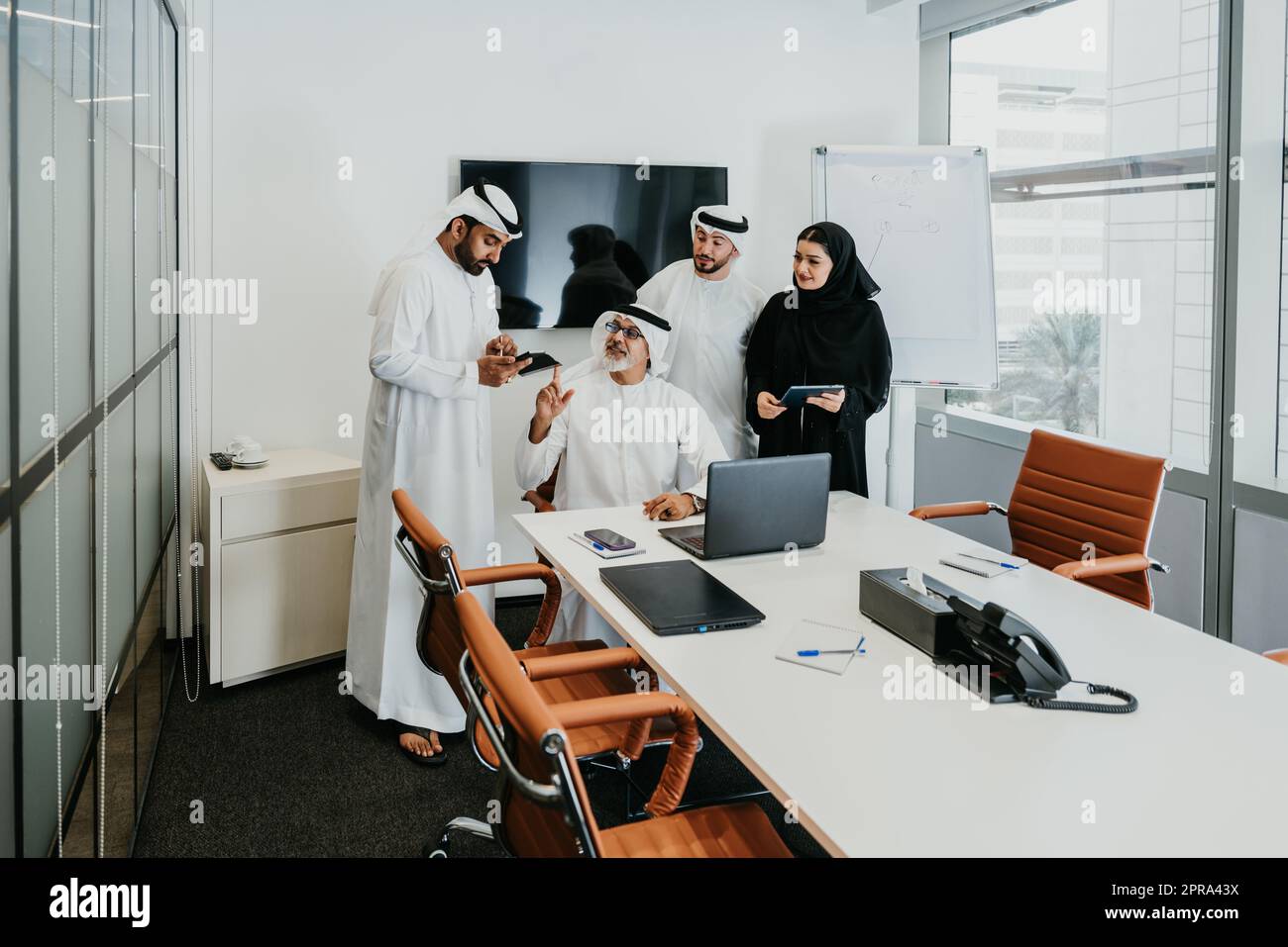 Group of middle-eastern corporate business people wearing traditional ...