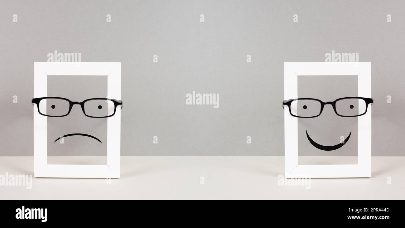 Frame with a sad and a happy face with eyeglasses, mental health ...