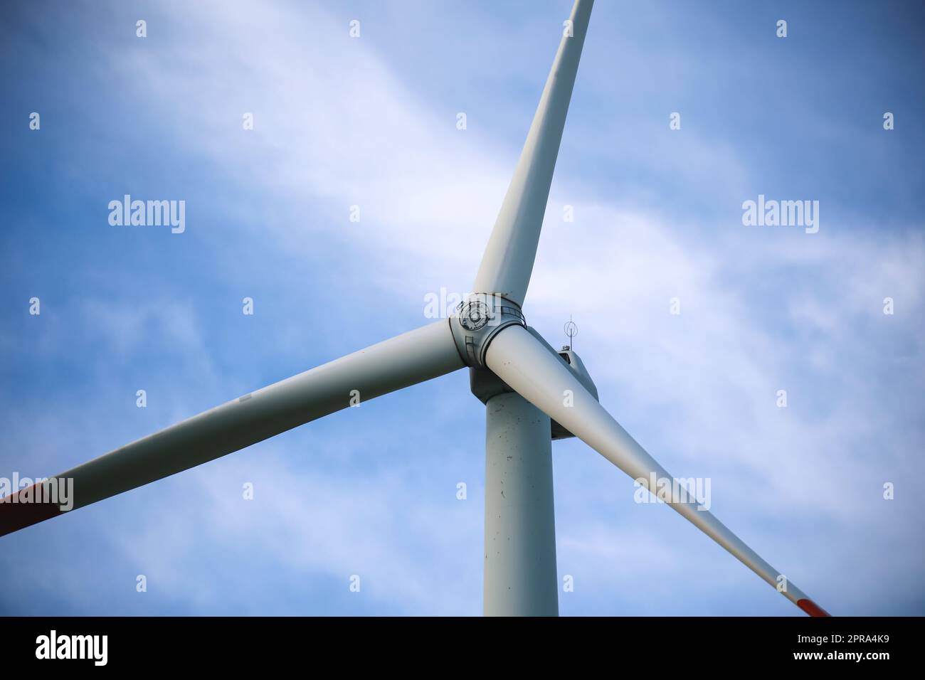 Close-up of the hub of a wind turbine. Blade and hub of a wind turbine ...