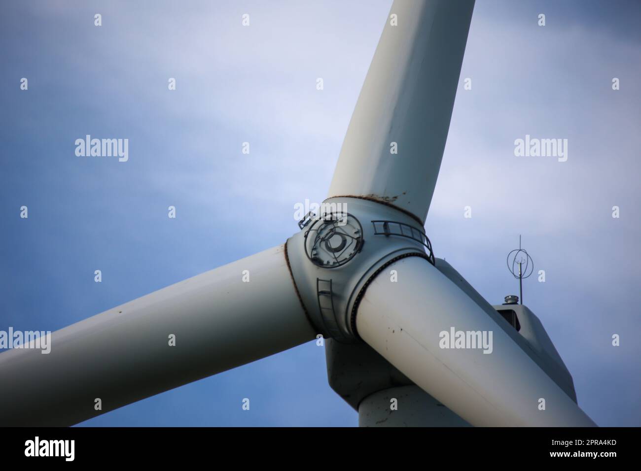 Close-up of the hub of a wind turbine. Blade and hub of a wind turbine ...