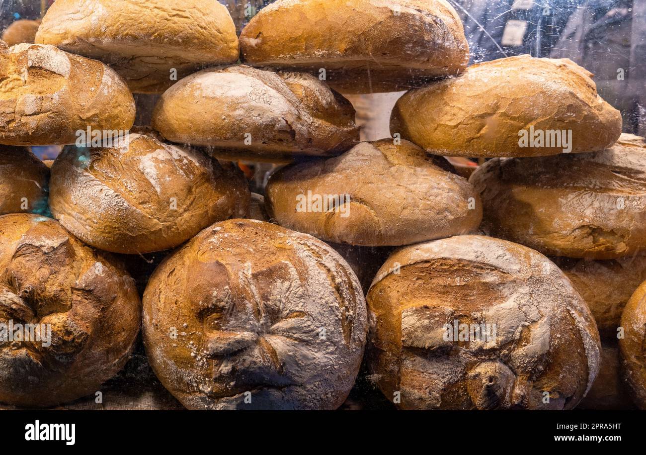 Lots of fresh hot freshly baked large round loaves of traditional ...