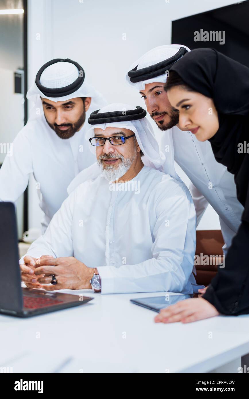 Group of middle-eastern corporate business people wearing traditional ...