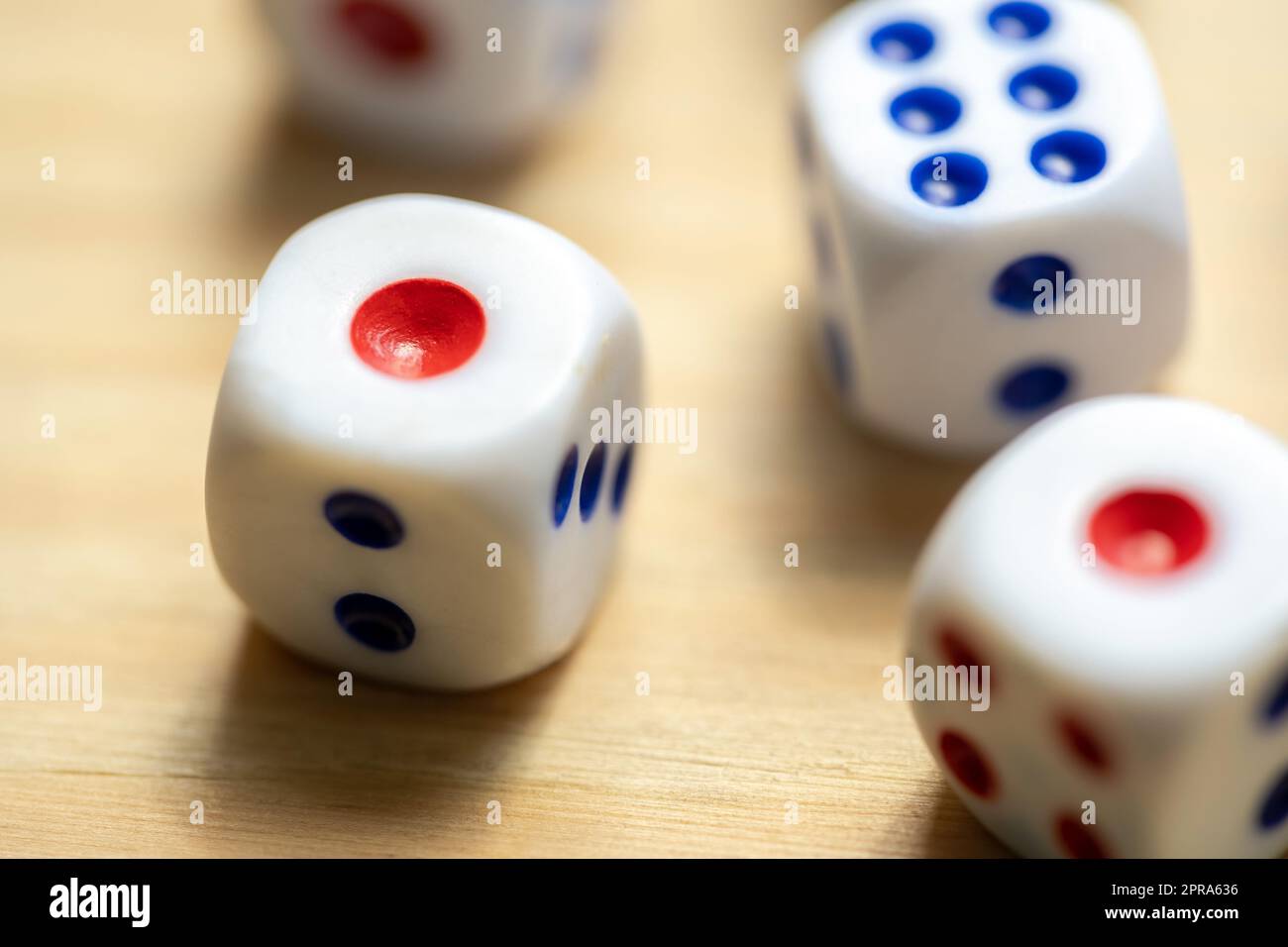 Set of a few simple game dice, central one showing number one. Chances ...