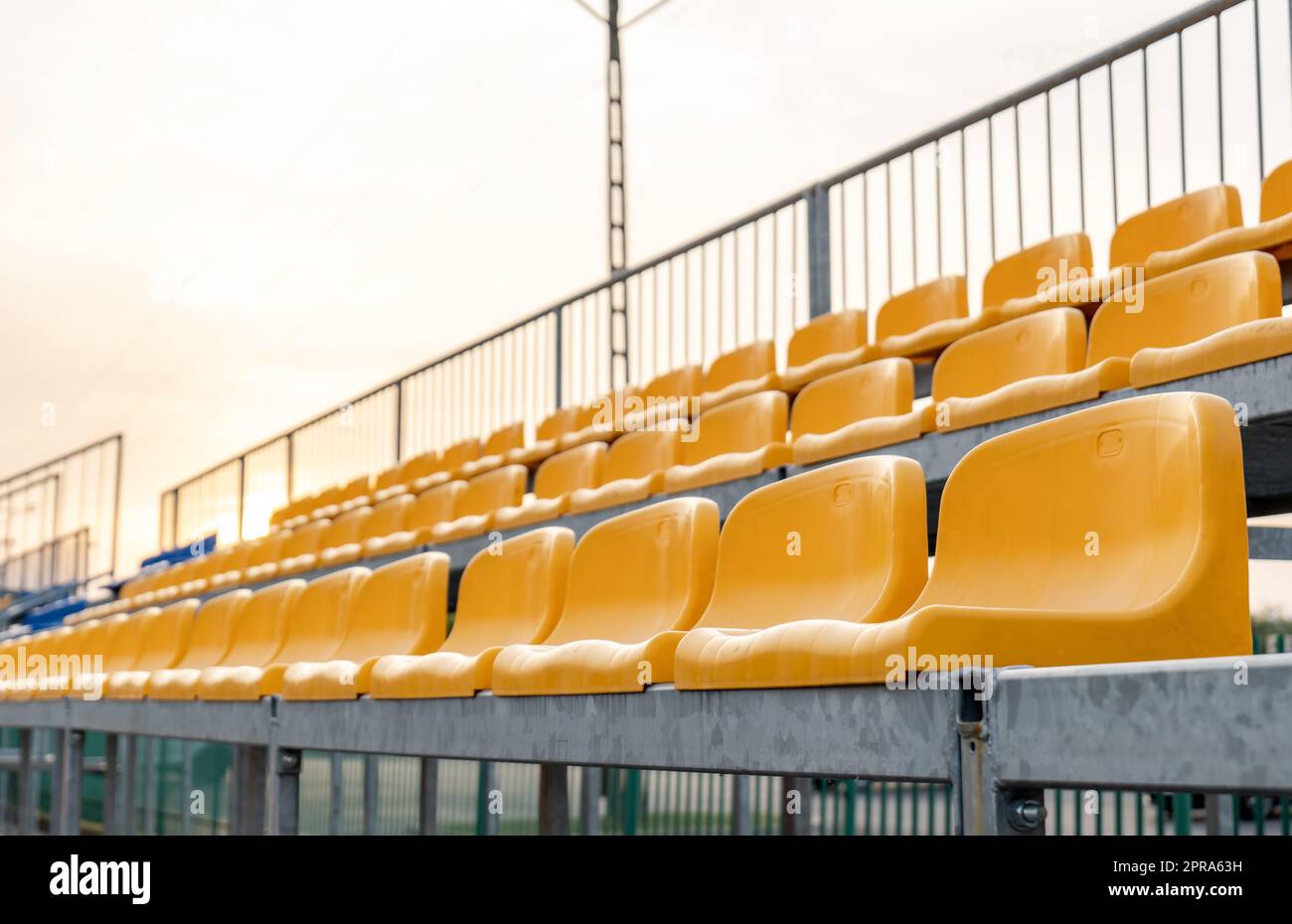 Empty vacant small stadium seats outdoors, bleachers, nobody, no people ...