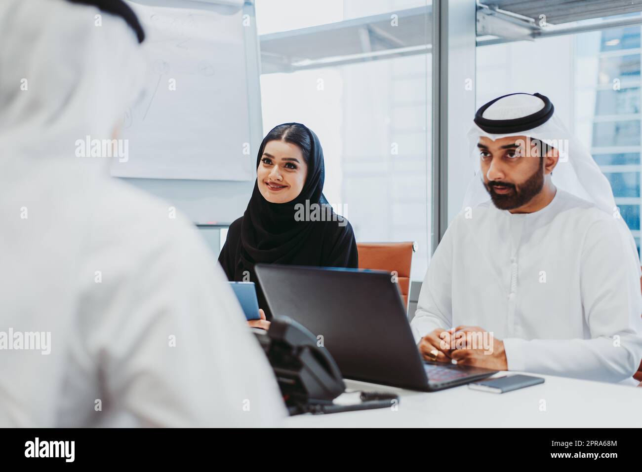 Group of middle-eastern corporate business people wearing traditional ...