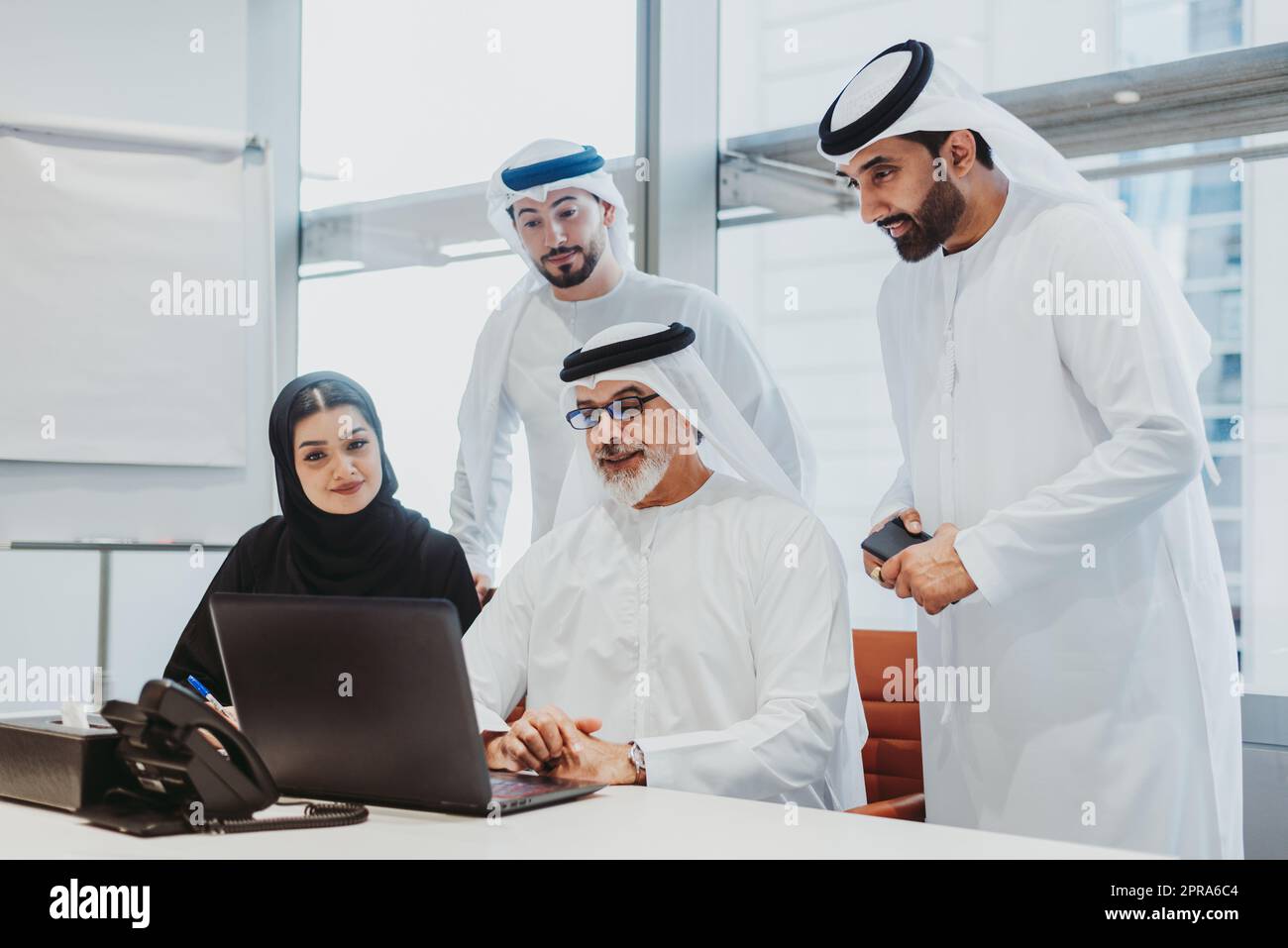 Group of middle-eastern corporate business people wearing traditional ...