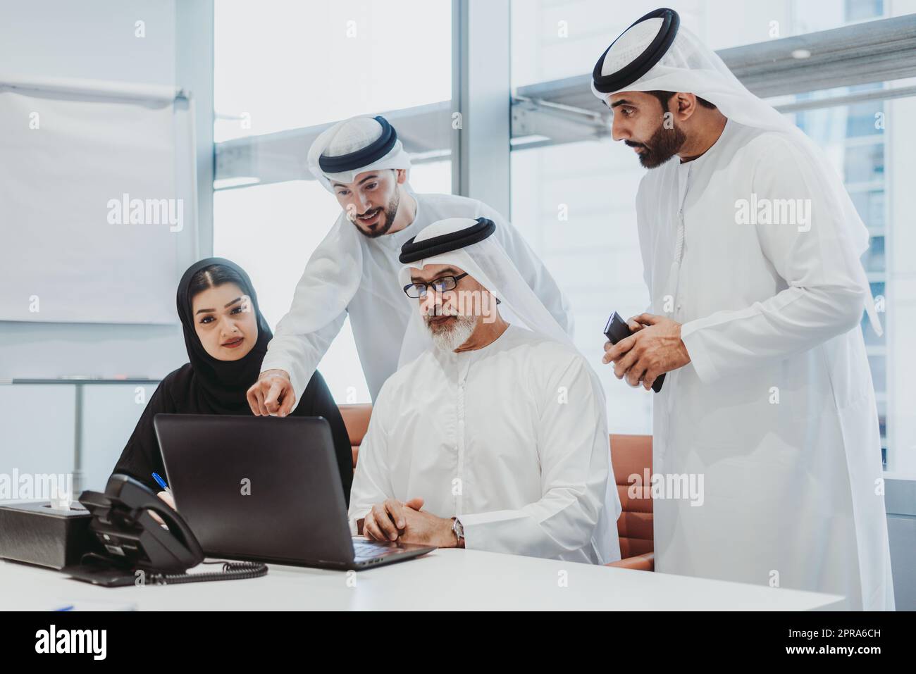 Group of middle-eastern corporate business people wearing traditional ...