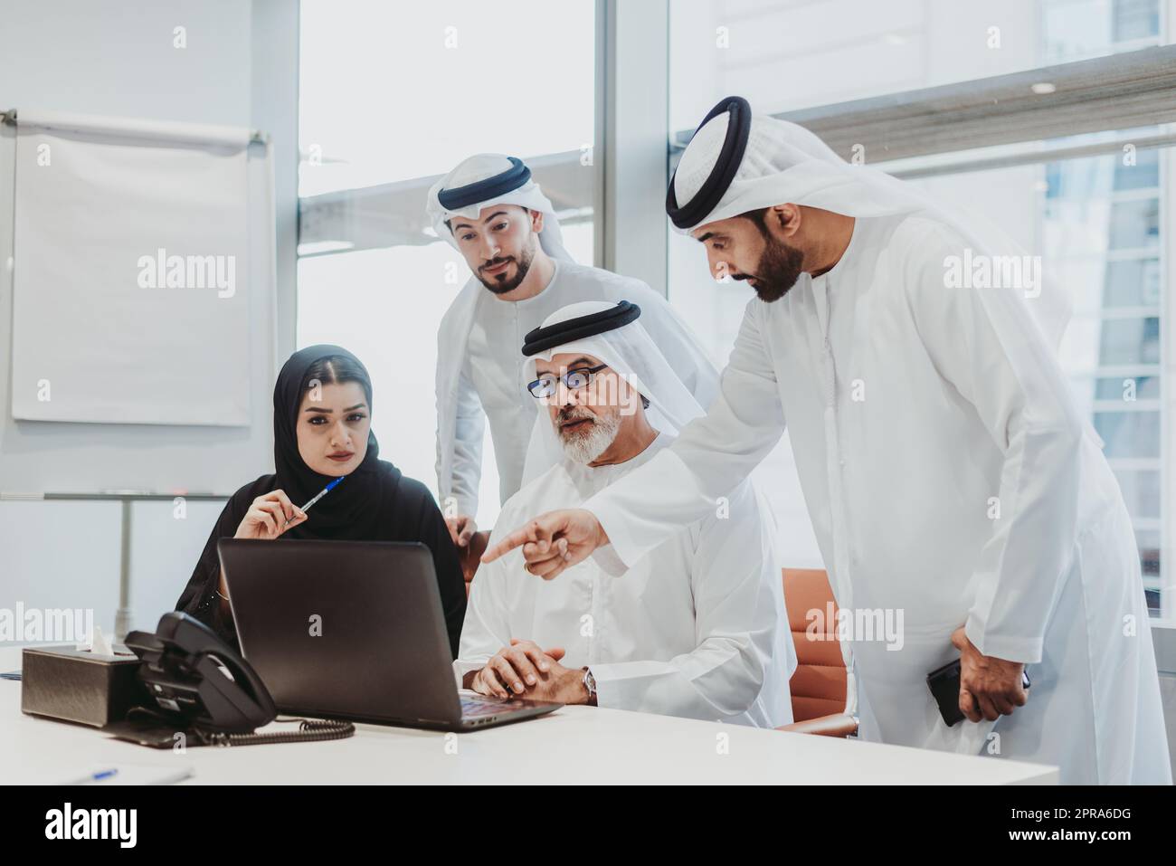 Group of middle-eastern corporate business people wearing traditional ...