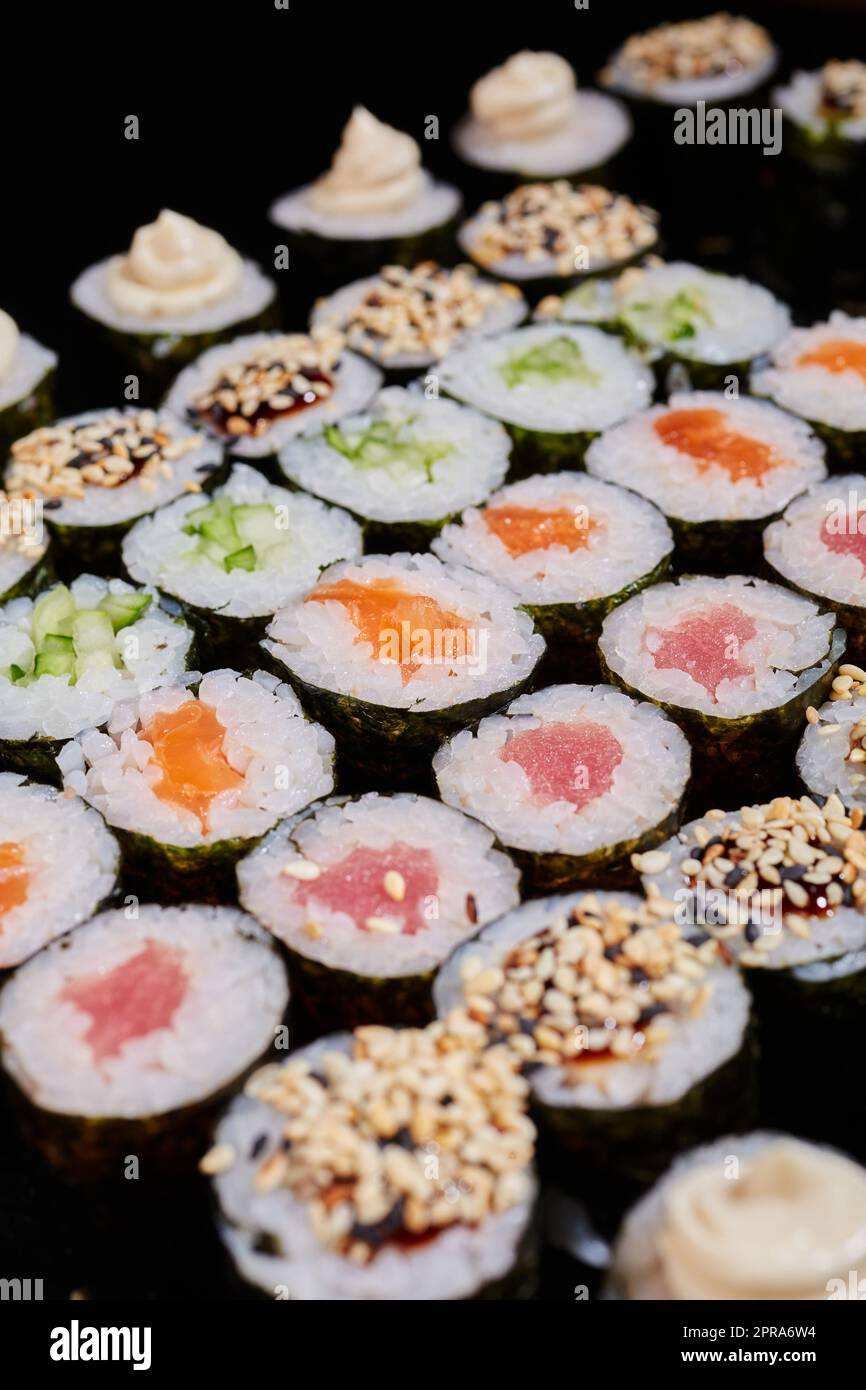 Large set of Maki rolls with a variety of fresh fish and vegetable ...