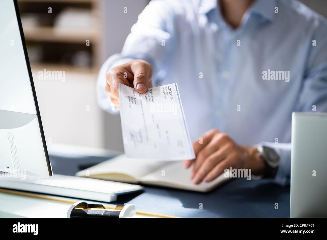 Businessperson Hands Giving Cheque Stock Photo - Alamy
