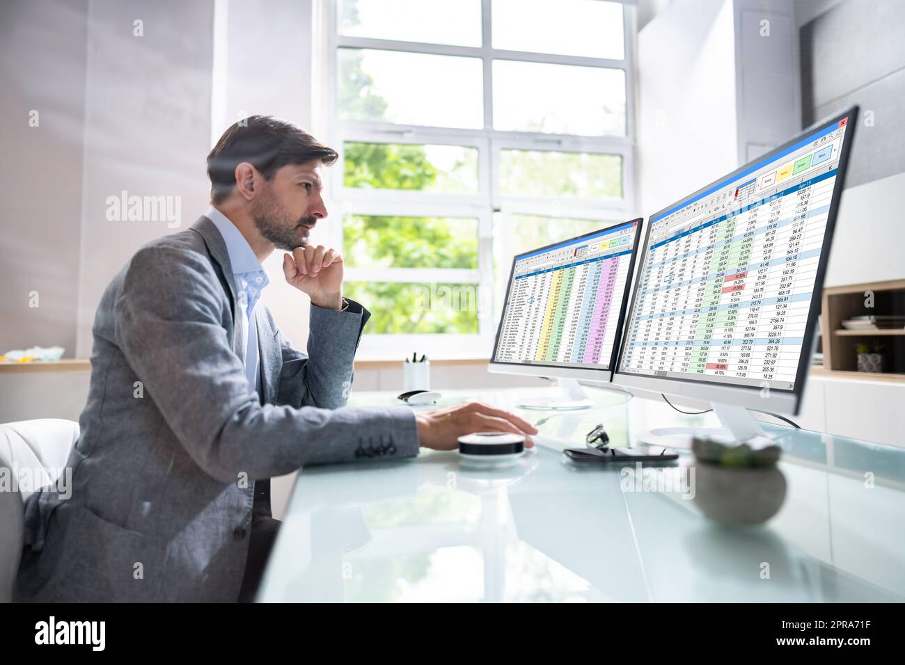 Young man working on spreadsheet hi-res stock photography and images ...