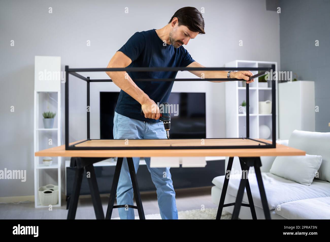 DIY Table Assembly In Domestic Apartment Stock Photo - Alamy