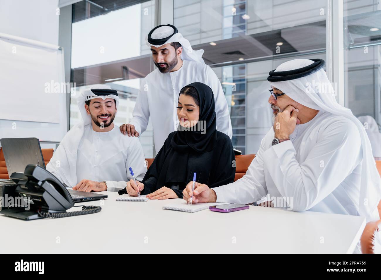 Group of middle-eastern corporate business people wearing traditional ...