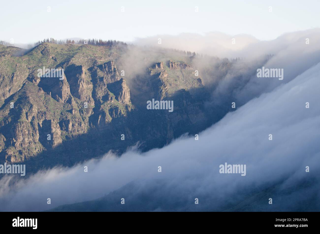 Cliffs of Chapin and sea of clouds descending the slope Stock Photo - Alamy