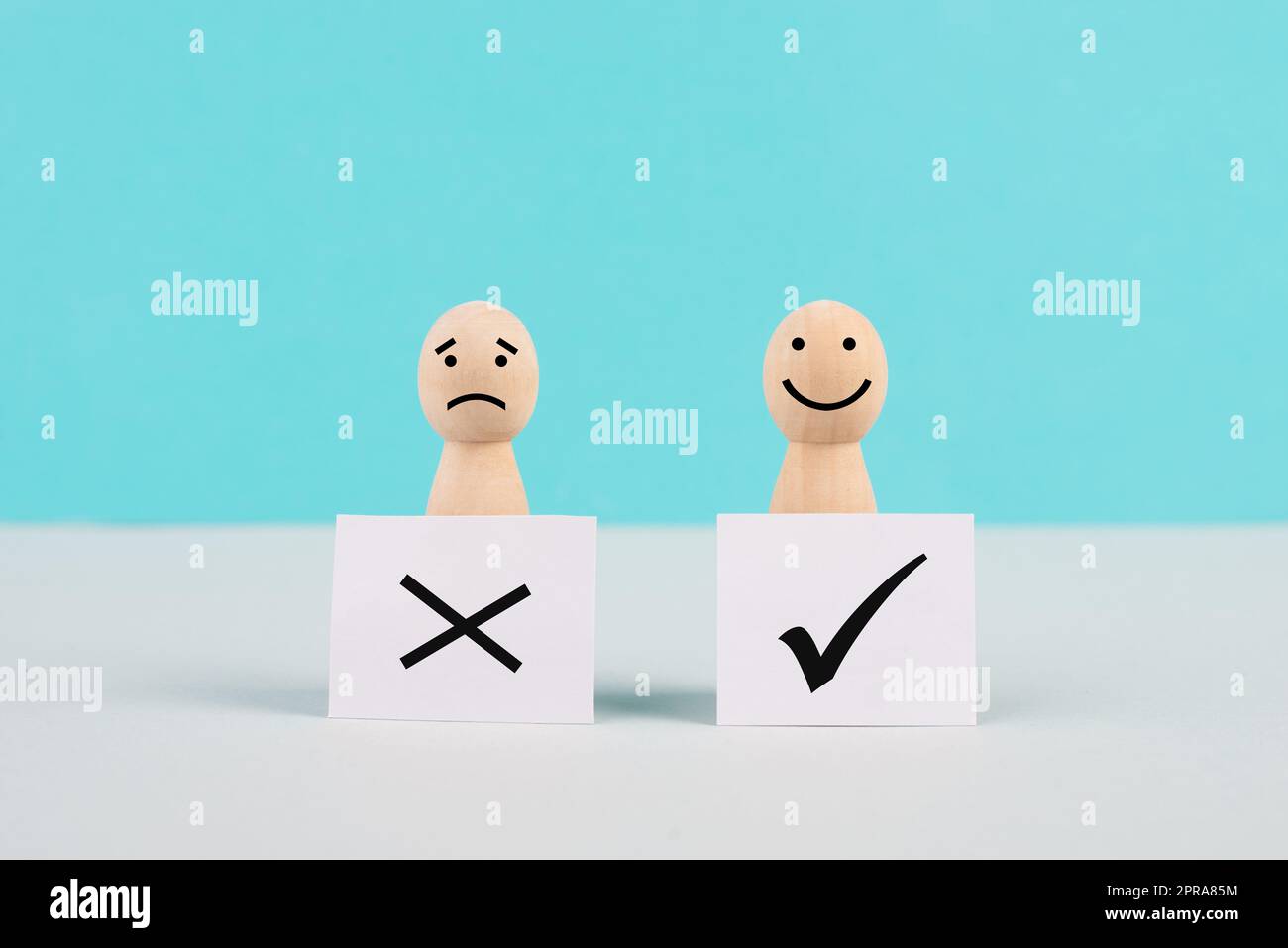 Men holding signs with a check mark and a cross, business and education ...