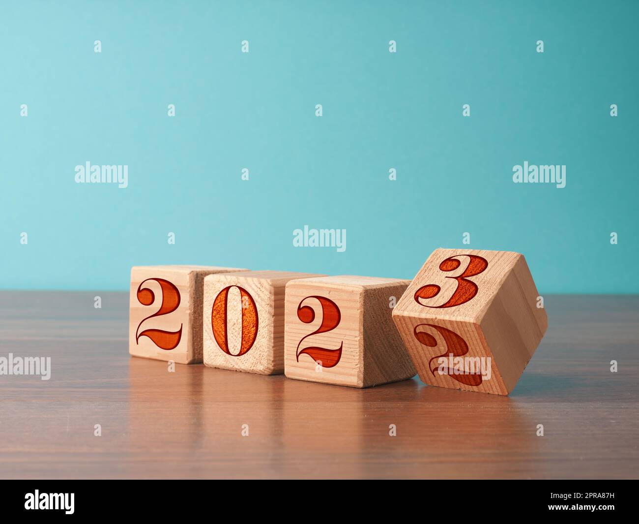 Flipping wooden cubes with the Year number 2022 and 2023, New Year ...