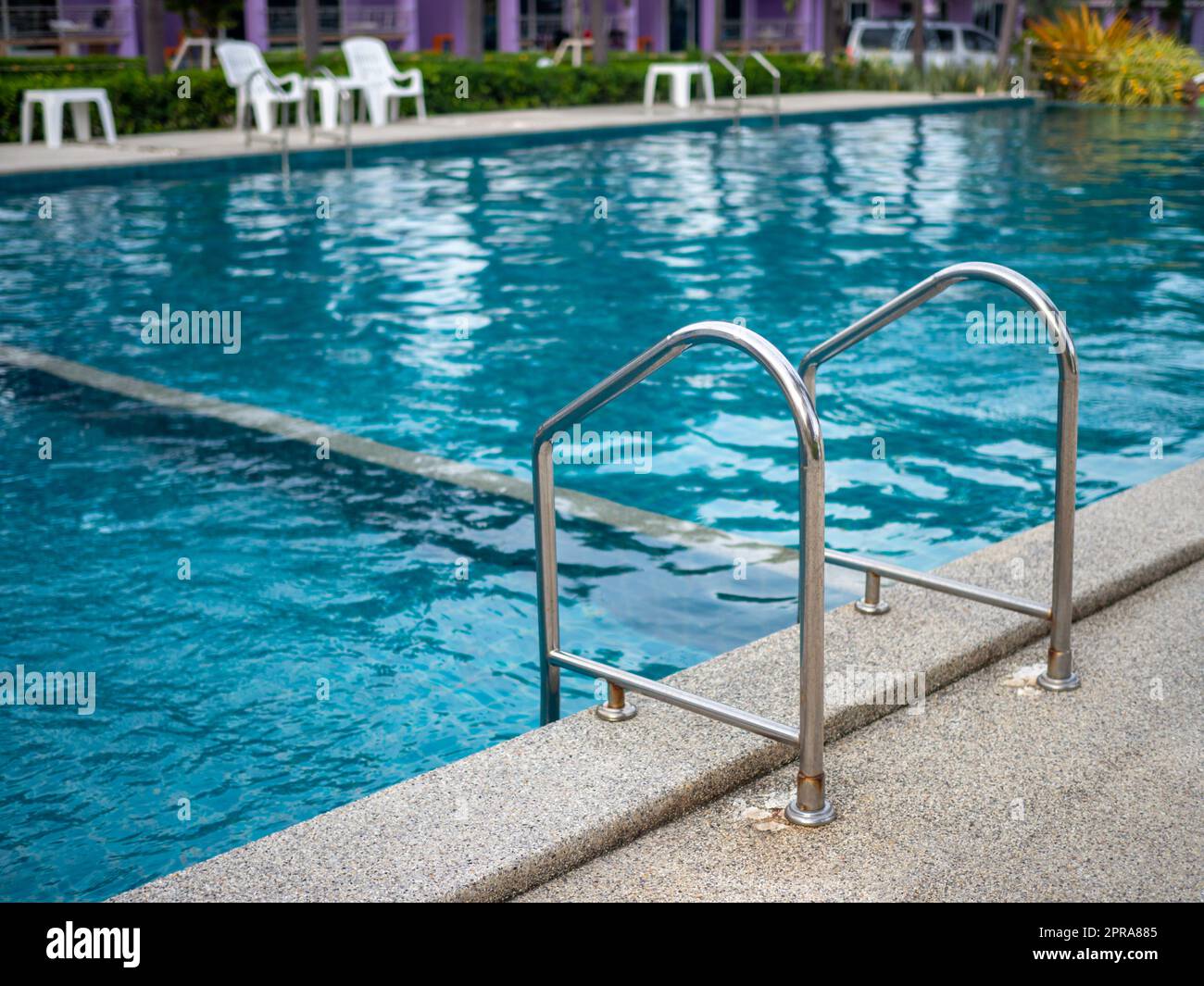 .Stainless steel stairs to the pool. handrails up and down the pool ...