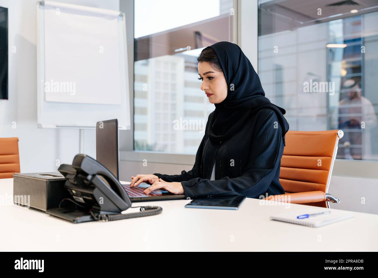 Portrait of beautiful middle-eastern corporate businesswoman wearing ...