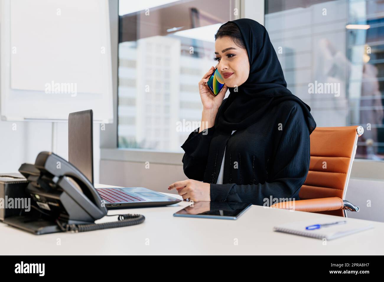 Portrait of beautiful middle-eastern corporate businesswoman wearing ...