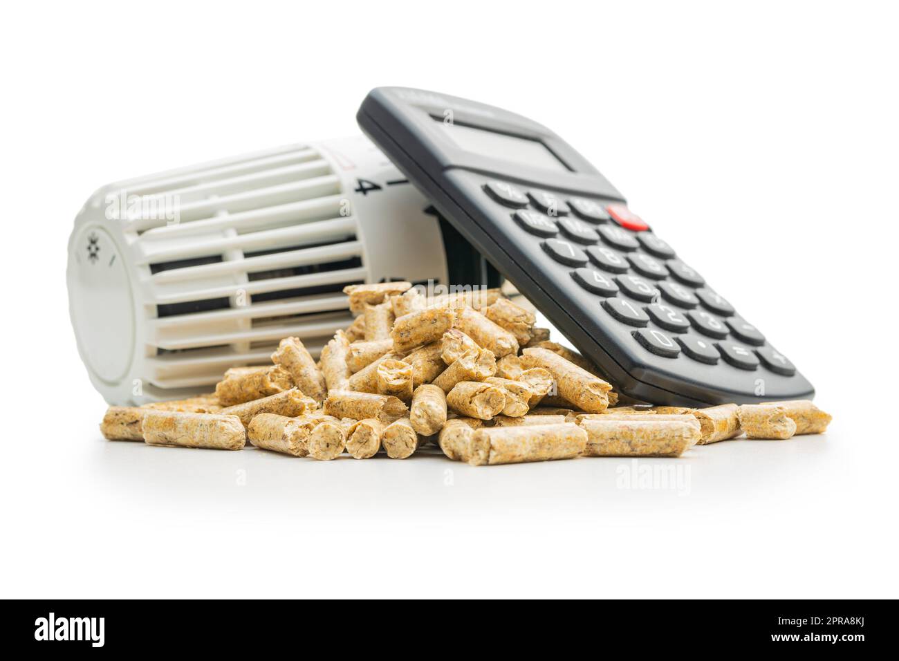 Wooden pellets, calculator and thermostatic valve head isolated on ...