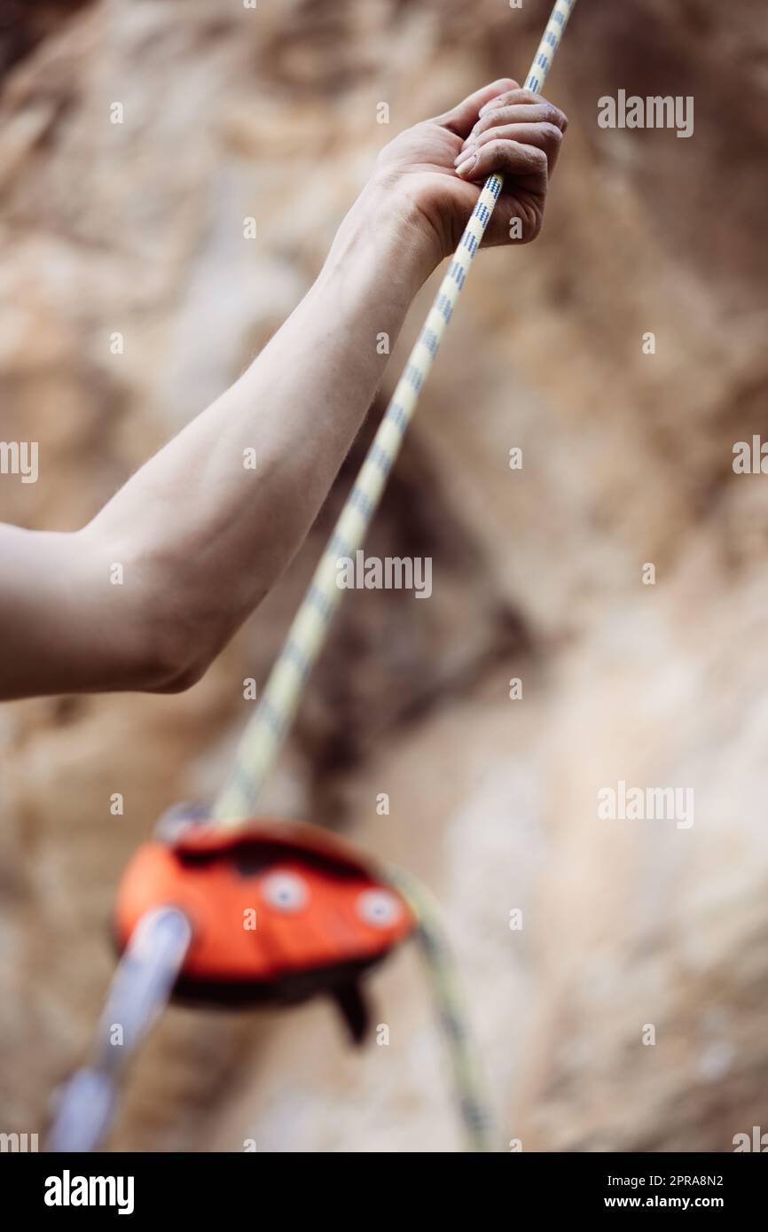 Hand holding a rock climbing rope Stock Photo - Alamy
