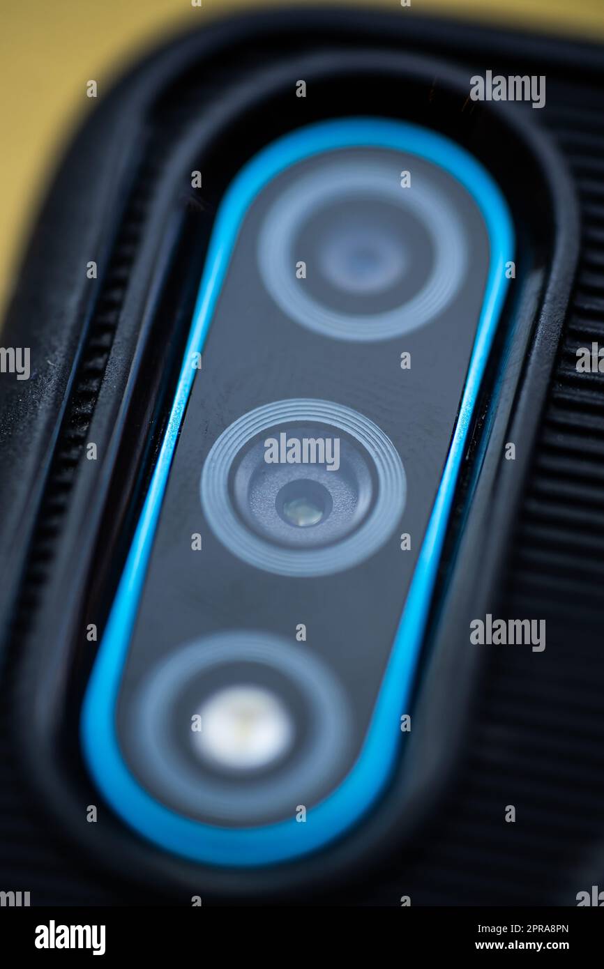 Modern mobile phone triple photo camera Stock Photo - Alamy