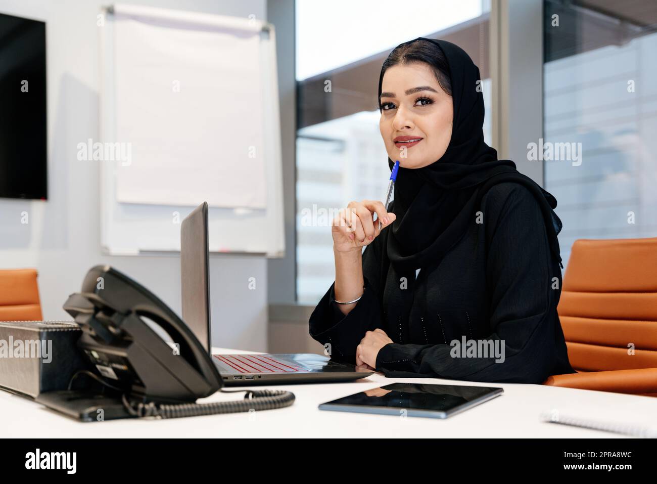 Portrait of beautiful middle-eastern corporate businesswoman wearing ...