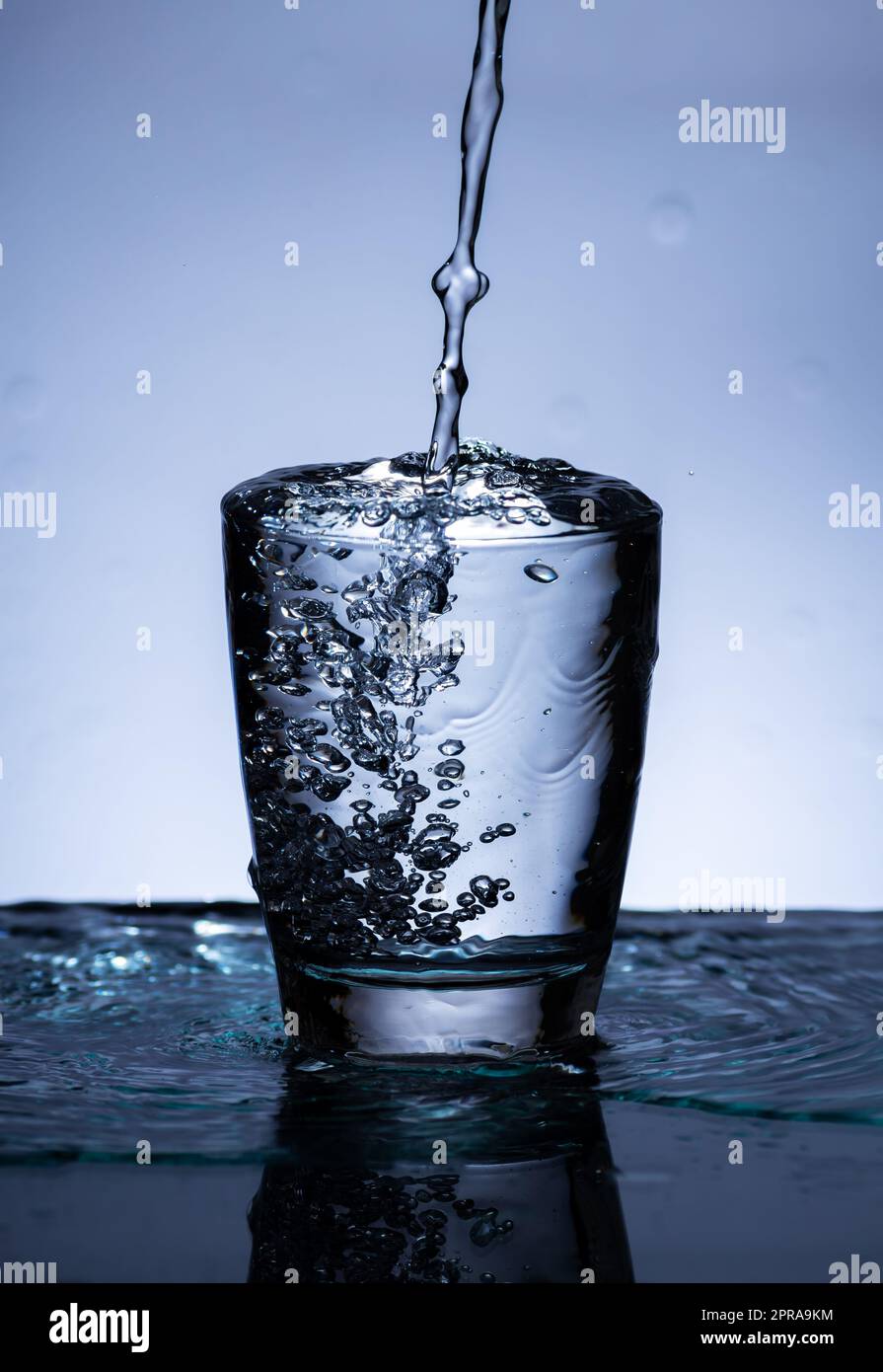 Drinking water pouring glass hi-res stock photography and images - Alamy