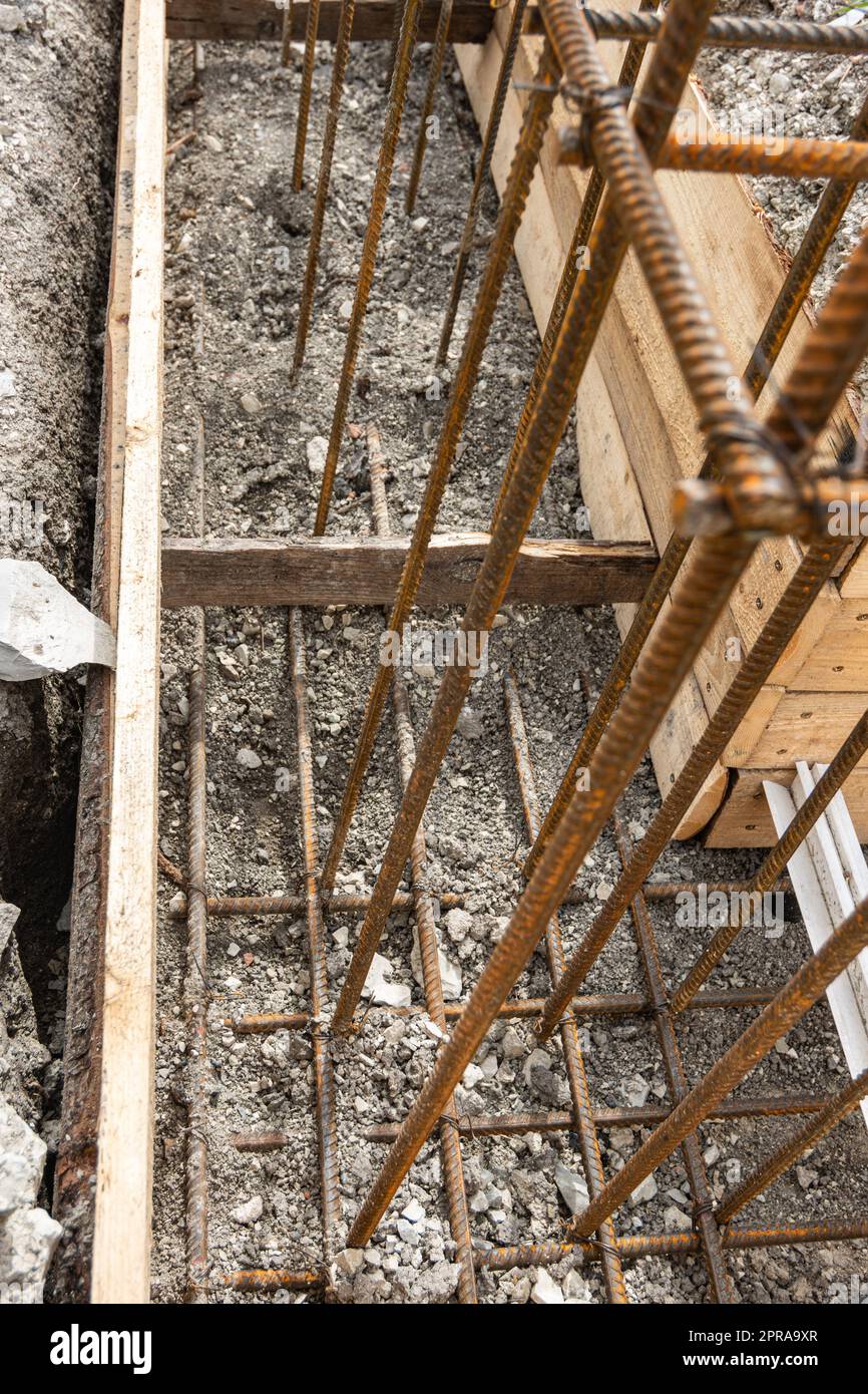 Reinforcement covered with earth during formwork collapse Stock Photo - Alamy