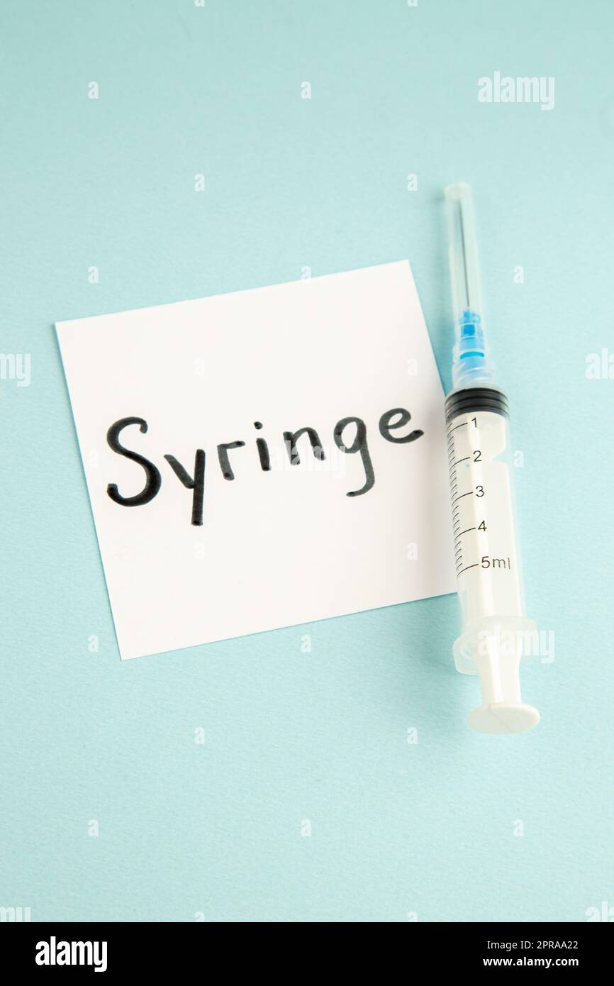front view antivirus injection with syringe note on blue background ...