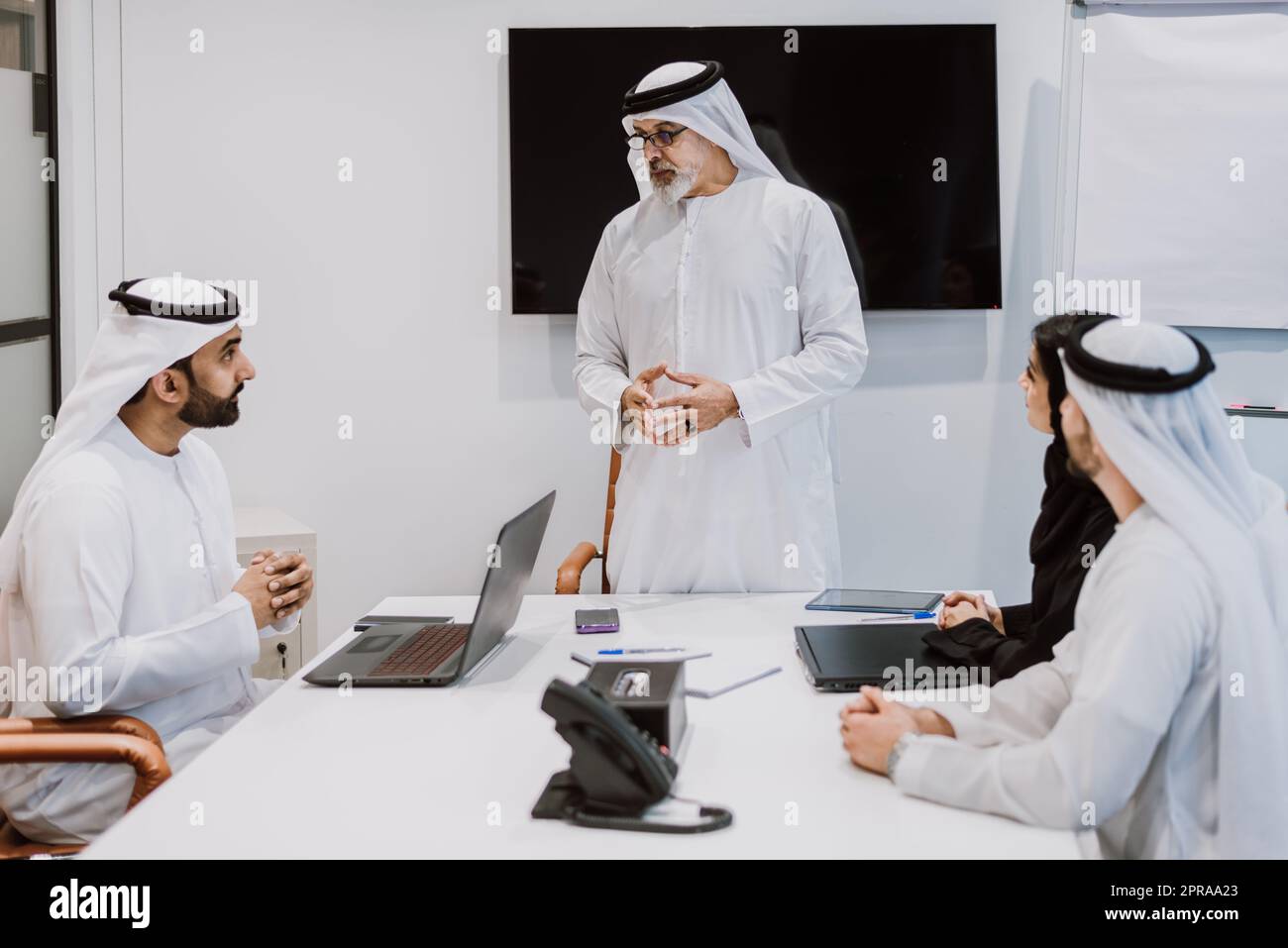 Group of middle-eastern corporate business people wearing traditional ...