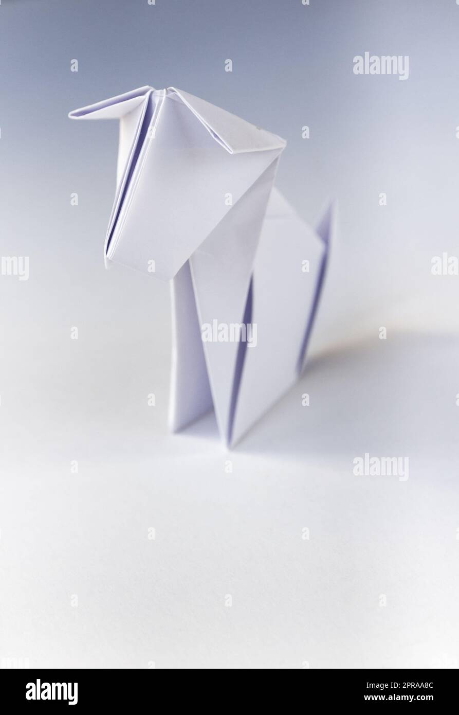 Paper dog origami isolated on a white background Stock Photo - Alamy
