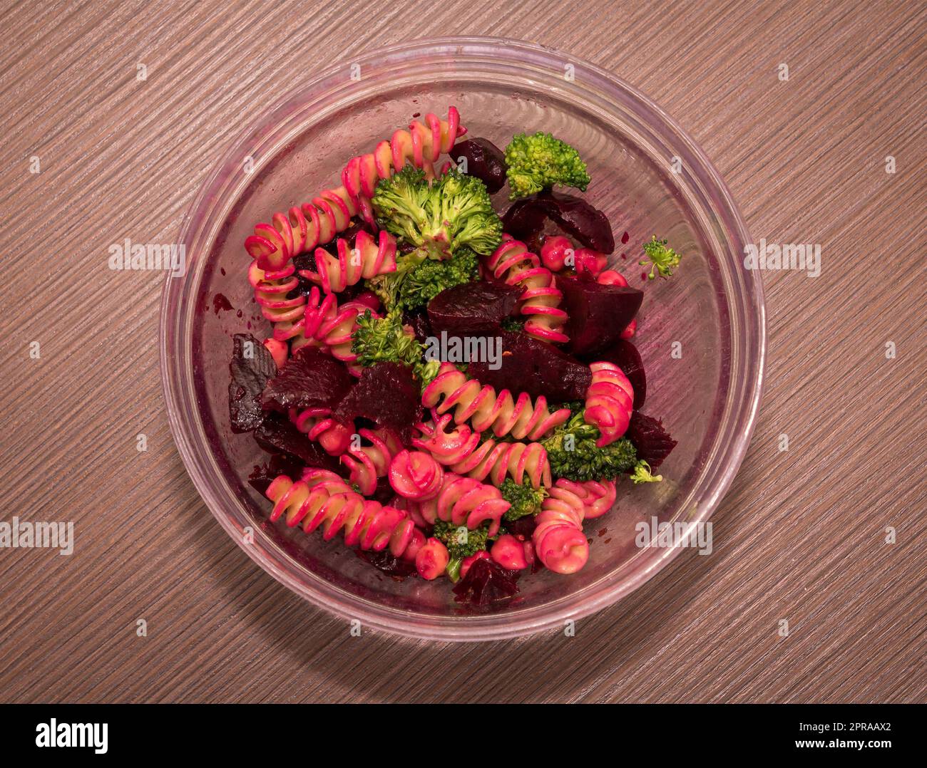 Broccoli and beetroot fusilli in glass bowl Stock Photo - Alamy