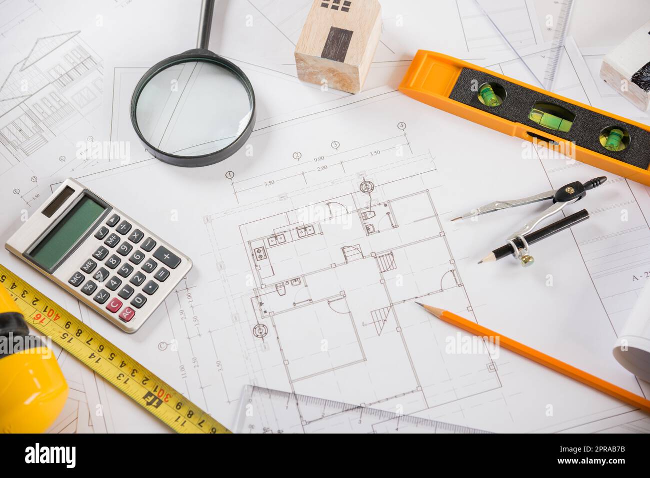 Top view of house plan blueprint paper with repair tools on table desk ...