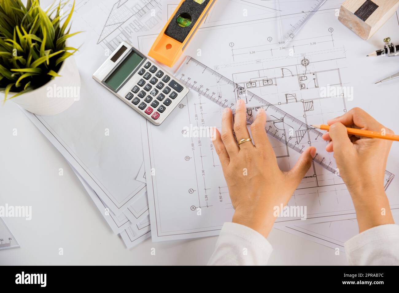Top view of architect drawing with ruler on house plan blueprint paper ...