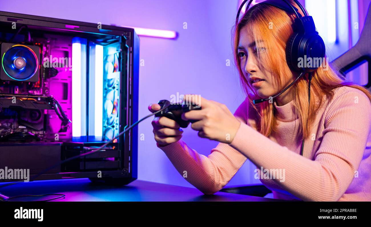 Gamer using joystick controller for virtual tournament plays online ...