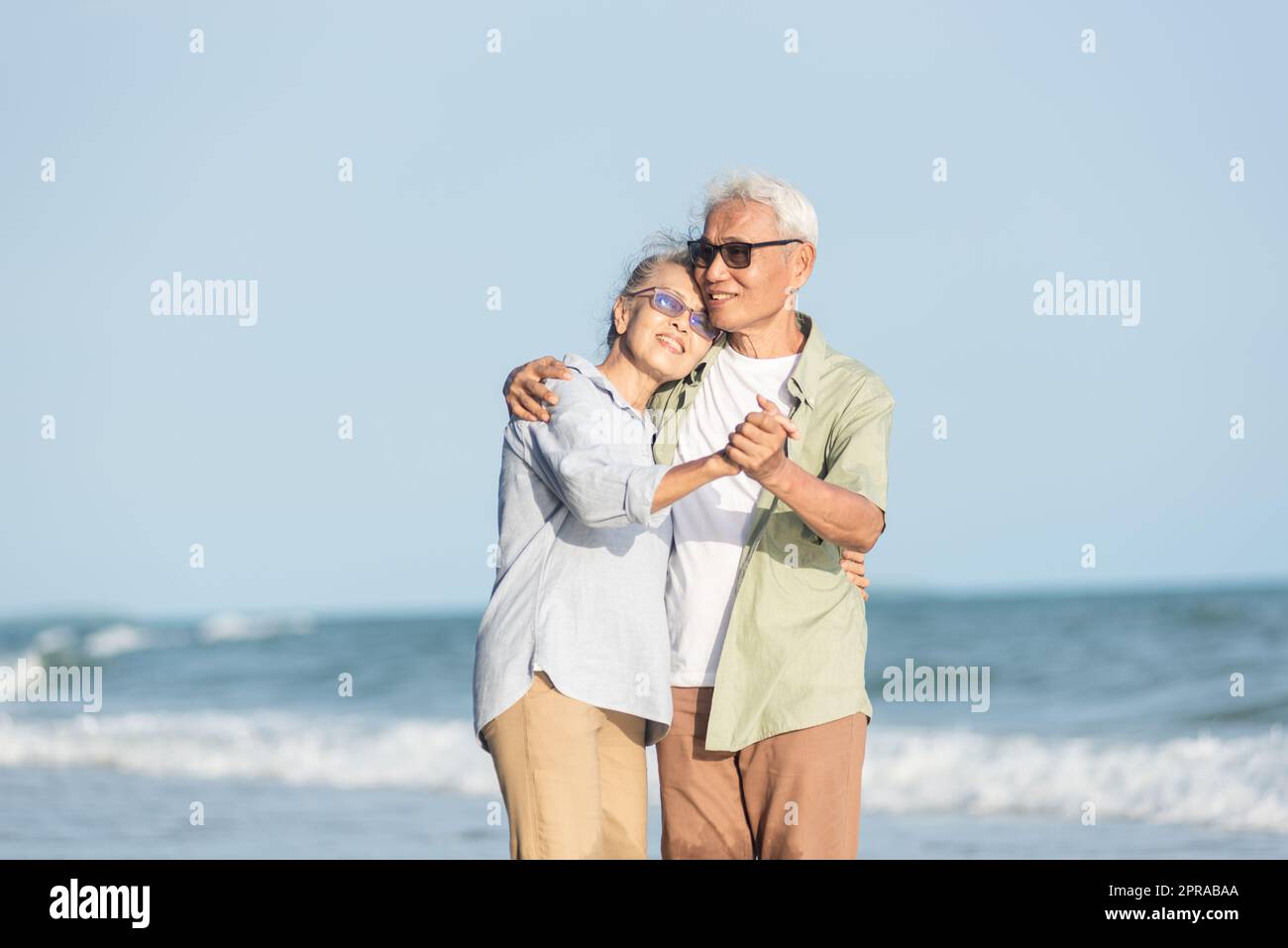 Happy Asian senior man and woman couple smile dancing resting relax on ...