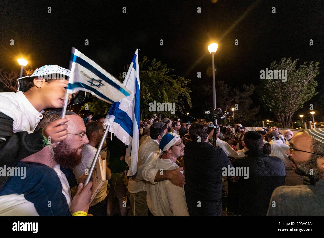 Harish, Israel. A child holds a Israeli flag during independence day ...