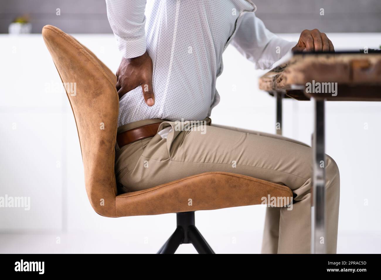 Young african man back pain hi-res stock photography and images - Alamy