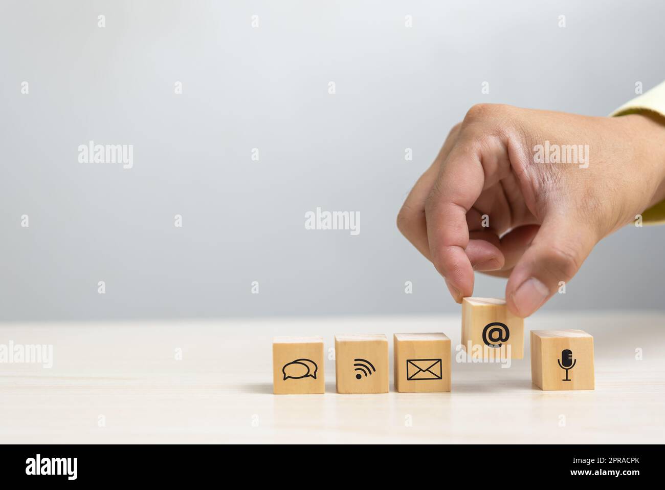 Hand holding wood cube block icon communication internet network ...