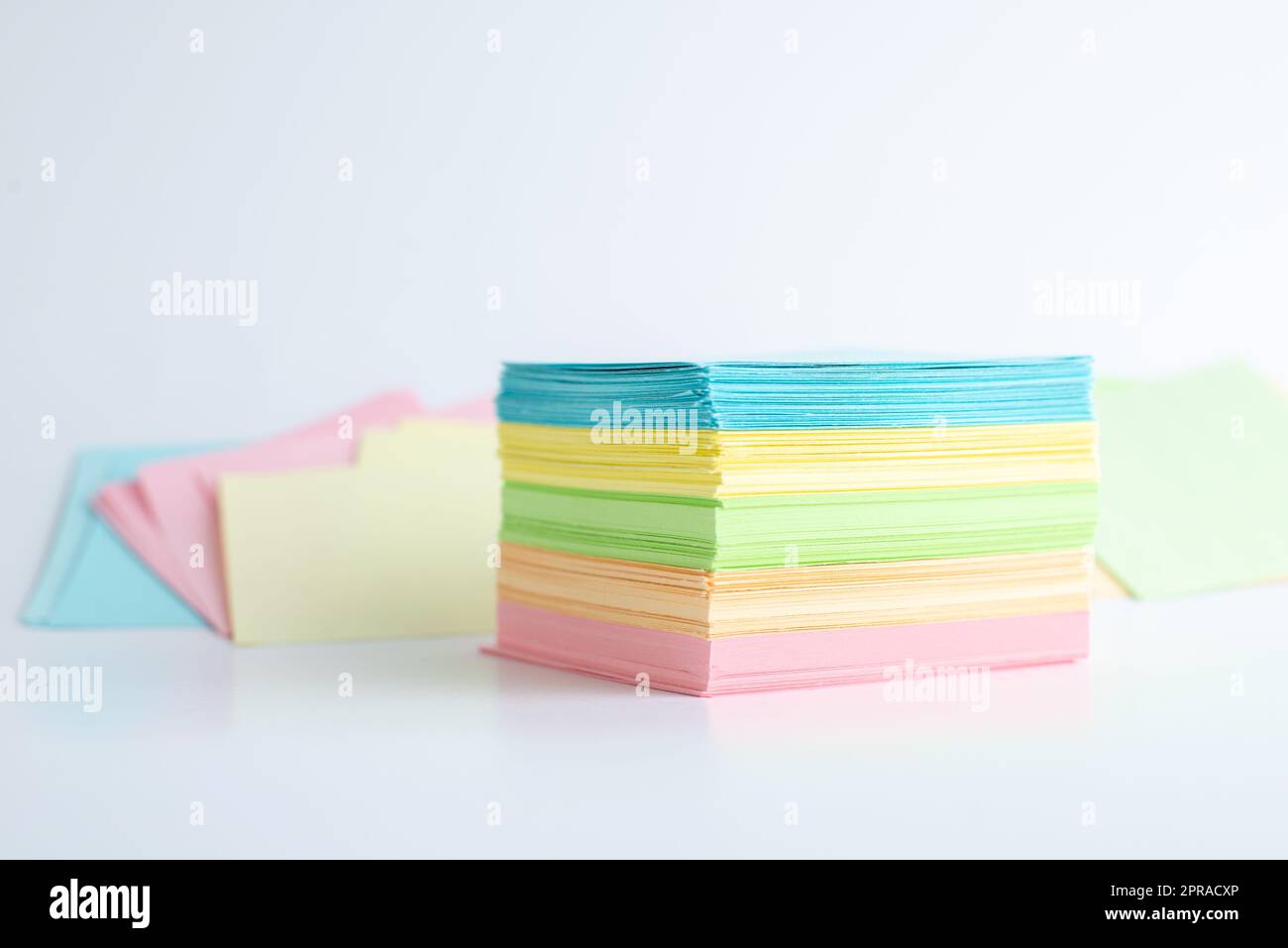 front view colored paper stickers on white background copybook note pen ...