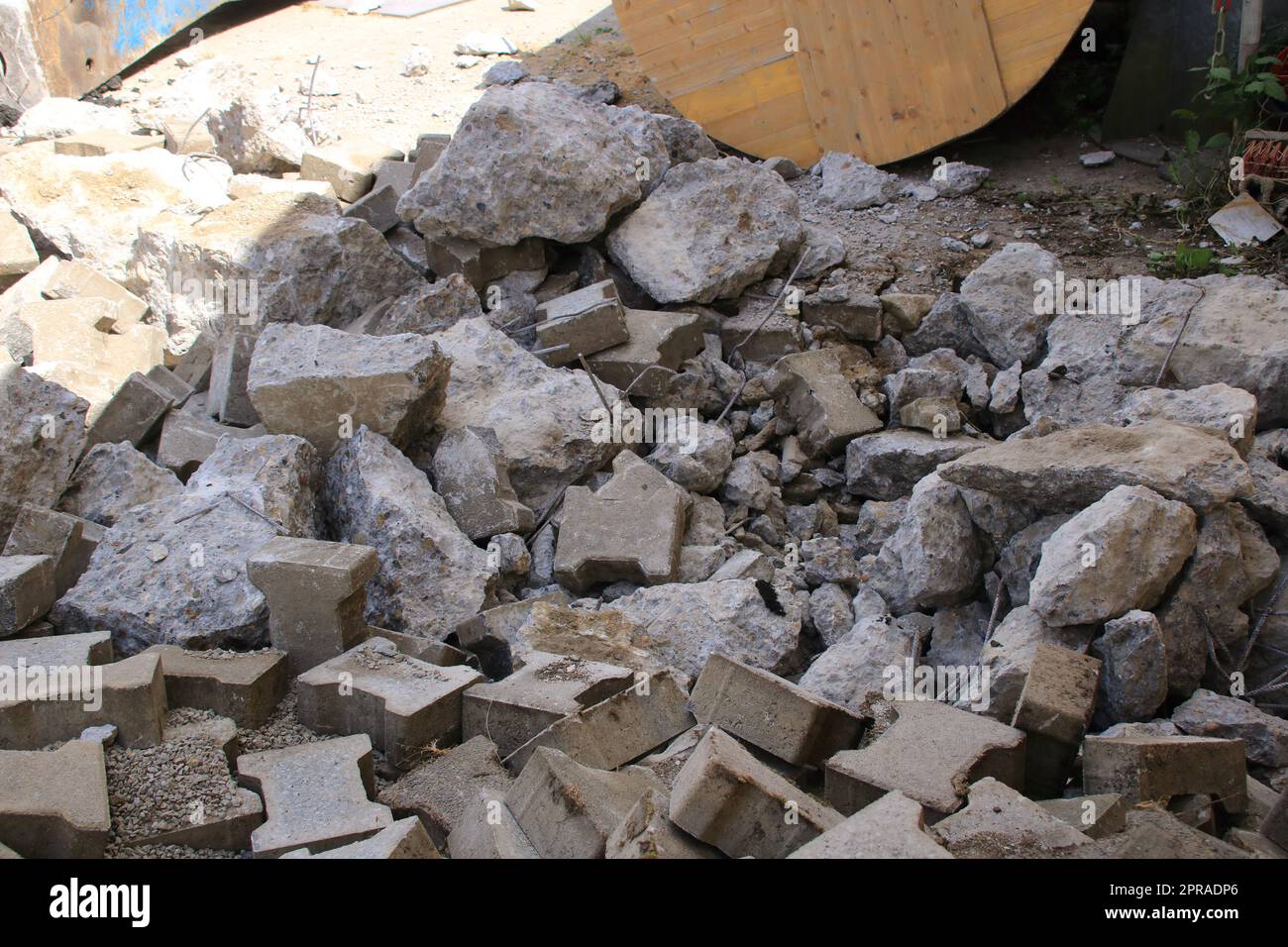 Concrete residues from building rubble were crushed with a chisel Stock ...