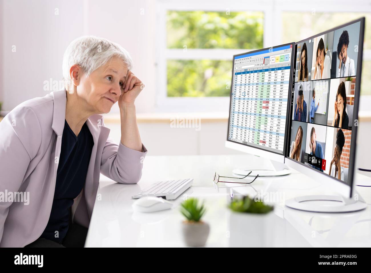 Bored Employee In Video Conference Training Stock Photo - Alamy