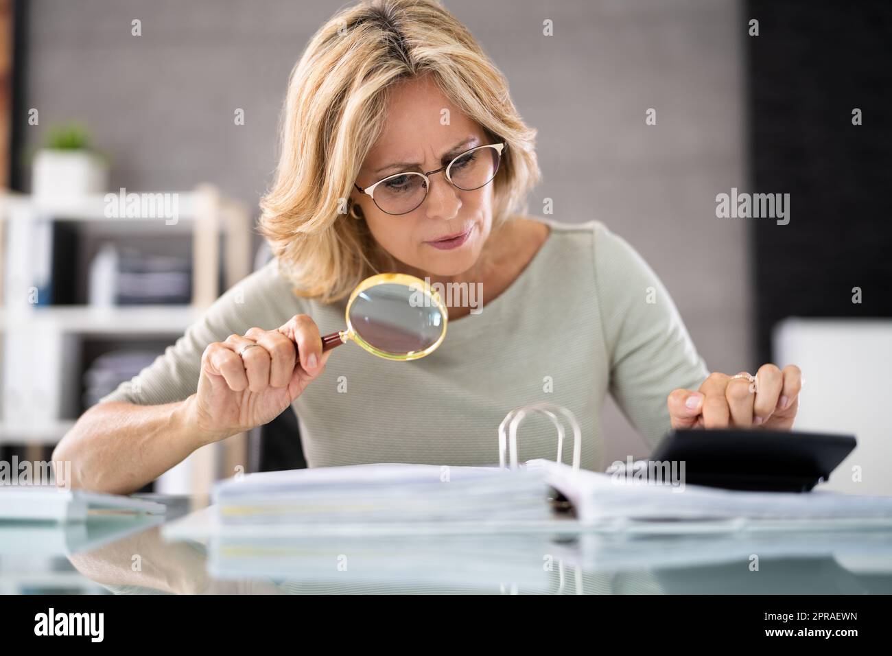 Investigate Fraud And Examine Document Stock Photo - Alamy
