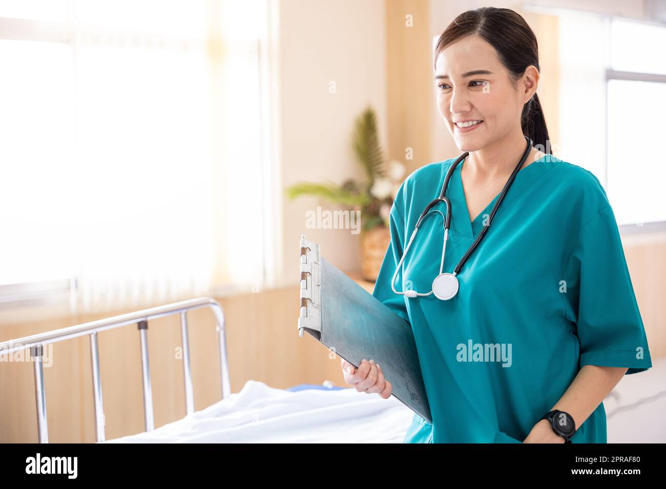 Portrait of a smiling nurse or medical staff in a hospital, happy woman ...