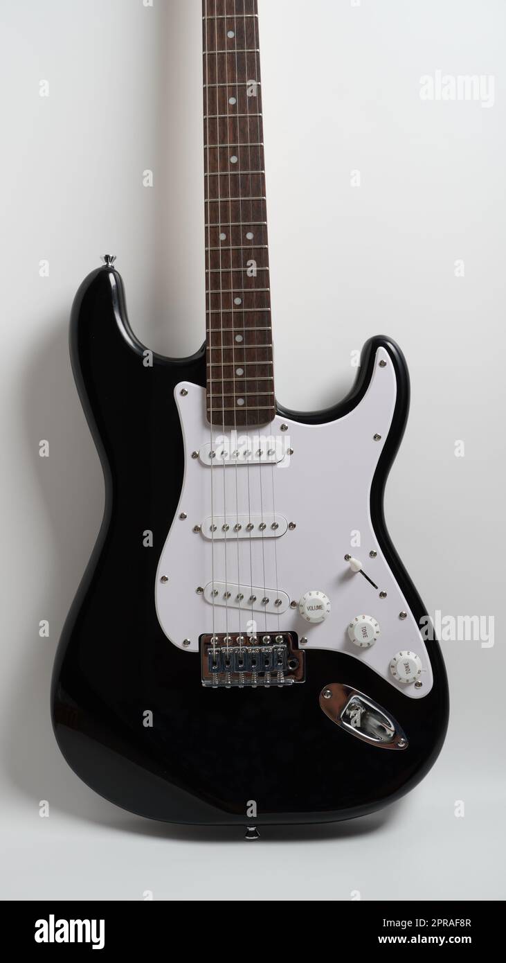 Black and white electric guitar on white background Stock Photo - Alamy