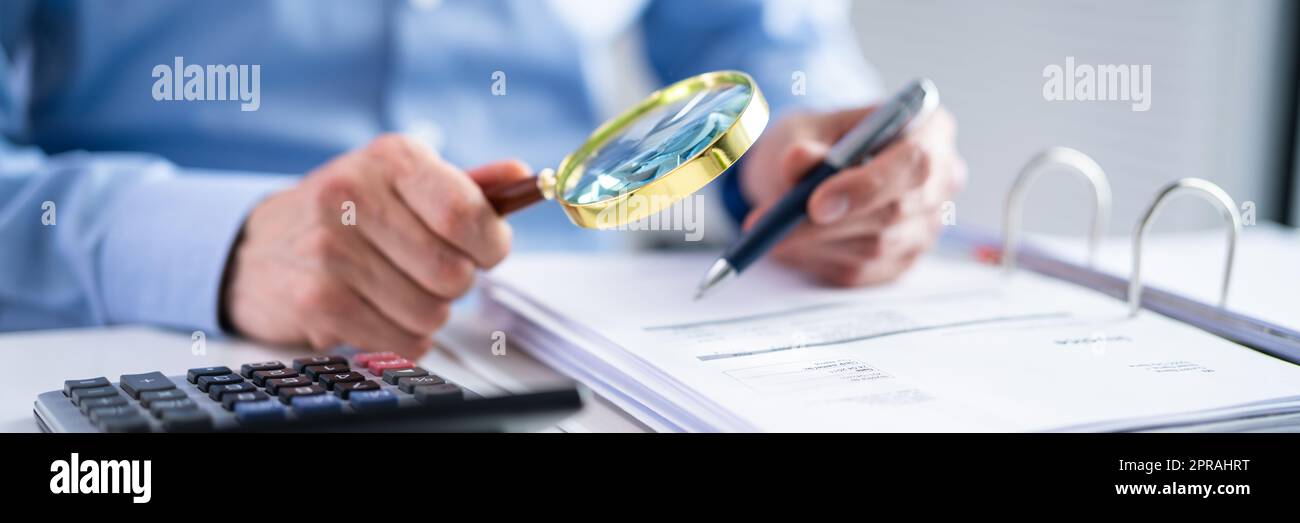 Business Fraud Investigation Using Magnifying Glass Stock Photo - Alamy