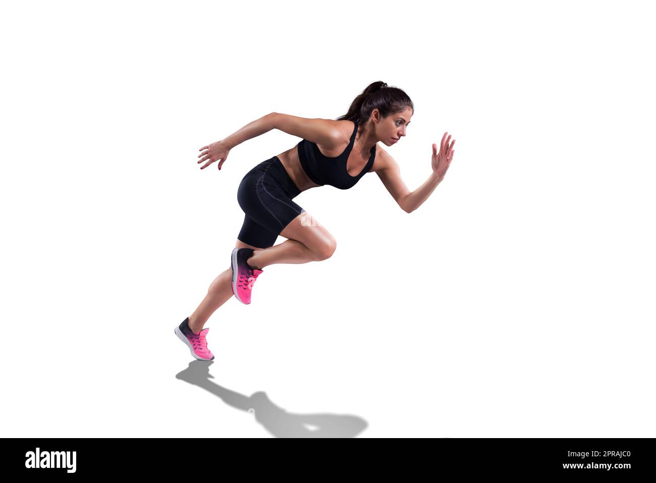 Athletic woman runs fast isolated on white background Stock Photo - Alamy