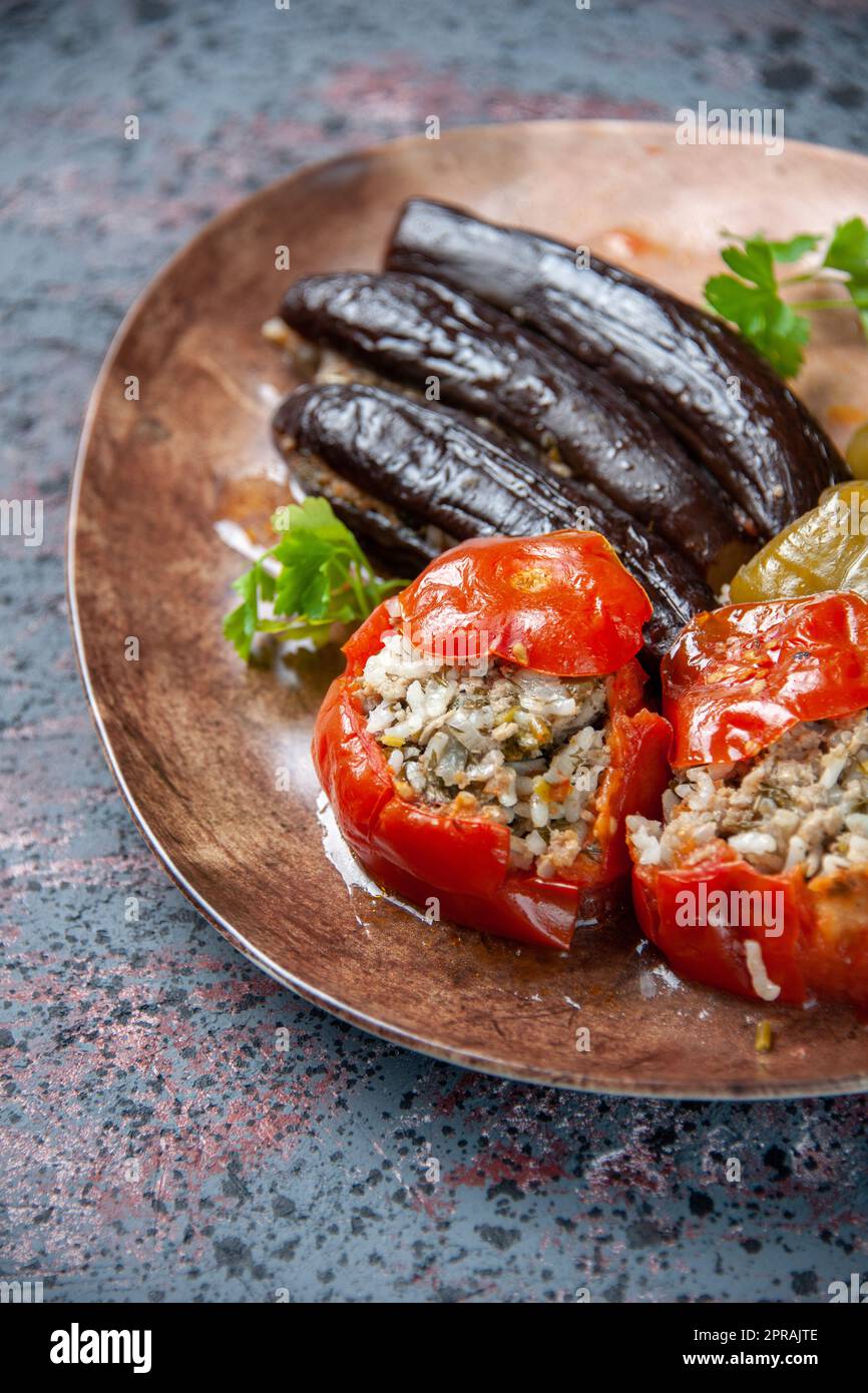 front view eggplant dolma with cooked tomatoes and bell-peppers filled ...